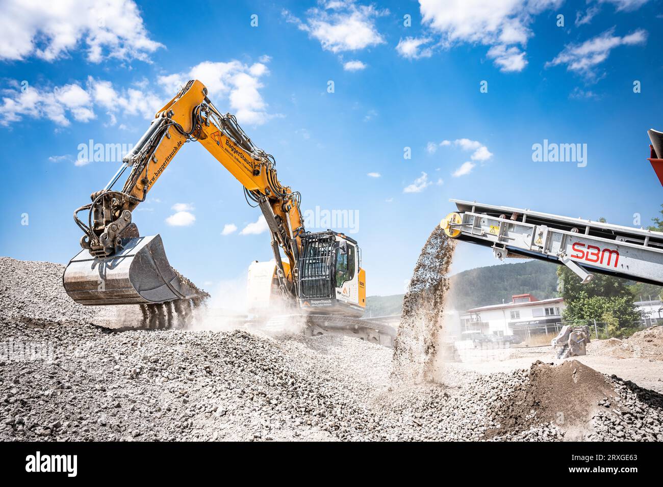 Yellow Liebherr crawler excavator recycling on demolition site Stock ...