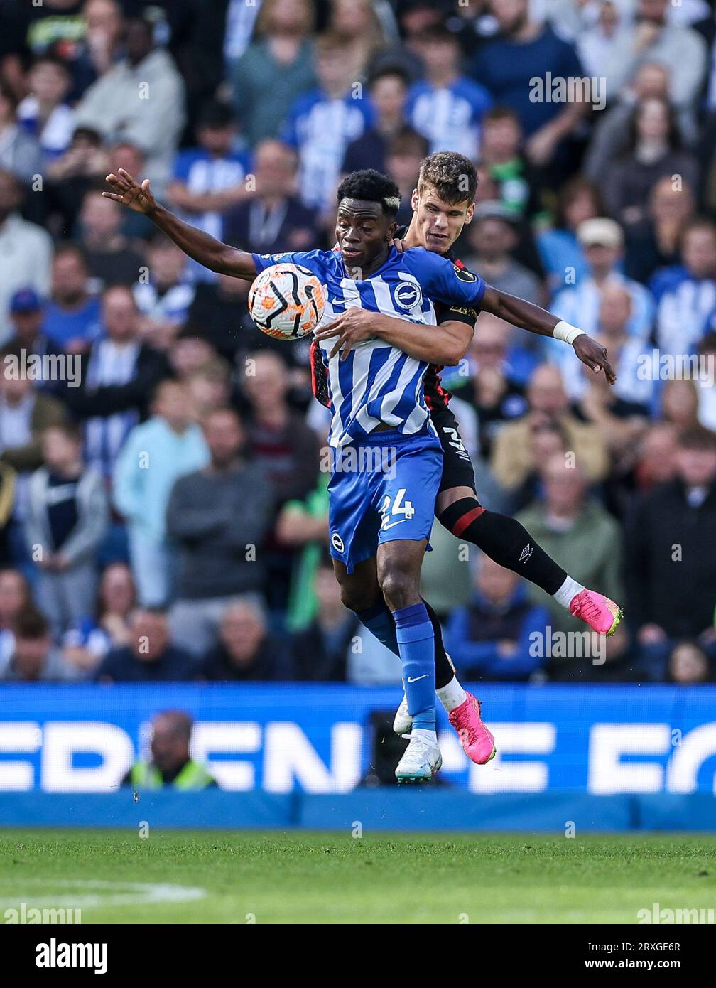 Brighton and Hove Albion's Simon Adingra and Bournemouth's Milos Kerkez ...