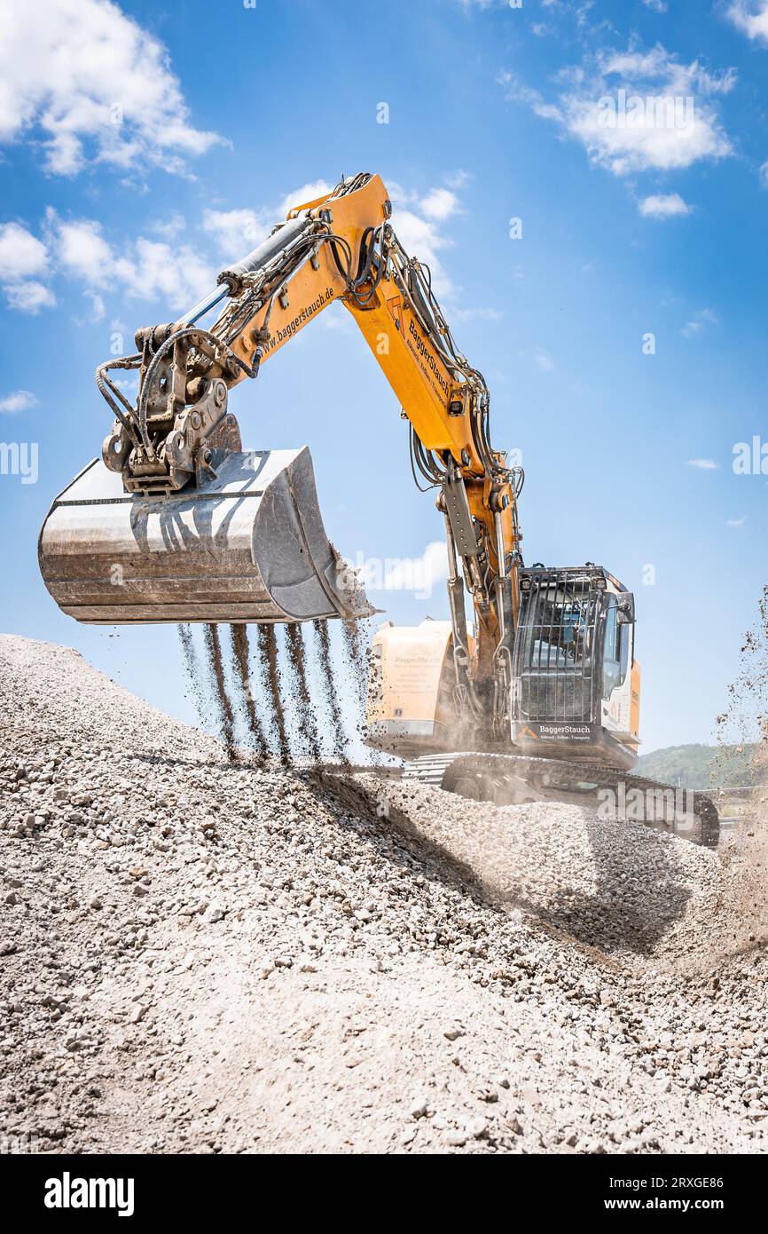 Yellow Liebherr crawler excavator recycling on demolition site Stock ...