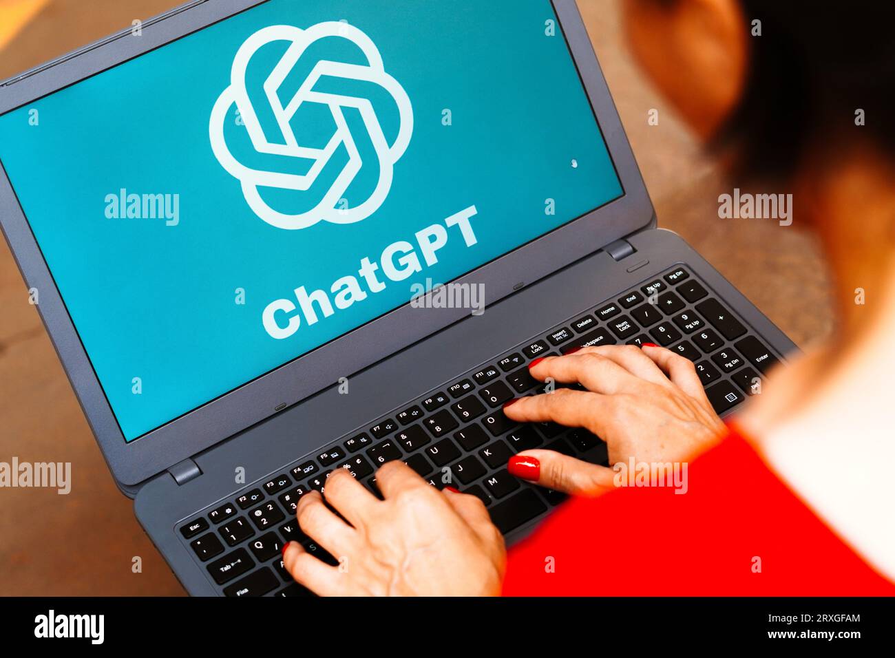 In this photo illustration, the ChatGPT logo is displayed on a notebook ...