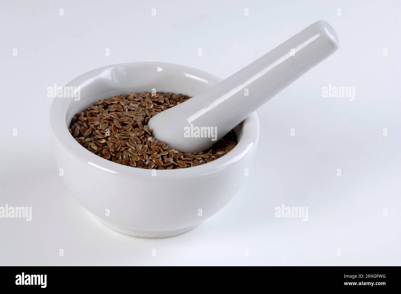 Common flax, linseed in mortar (Linum usitatissimum), linseed in mortar ...