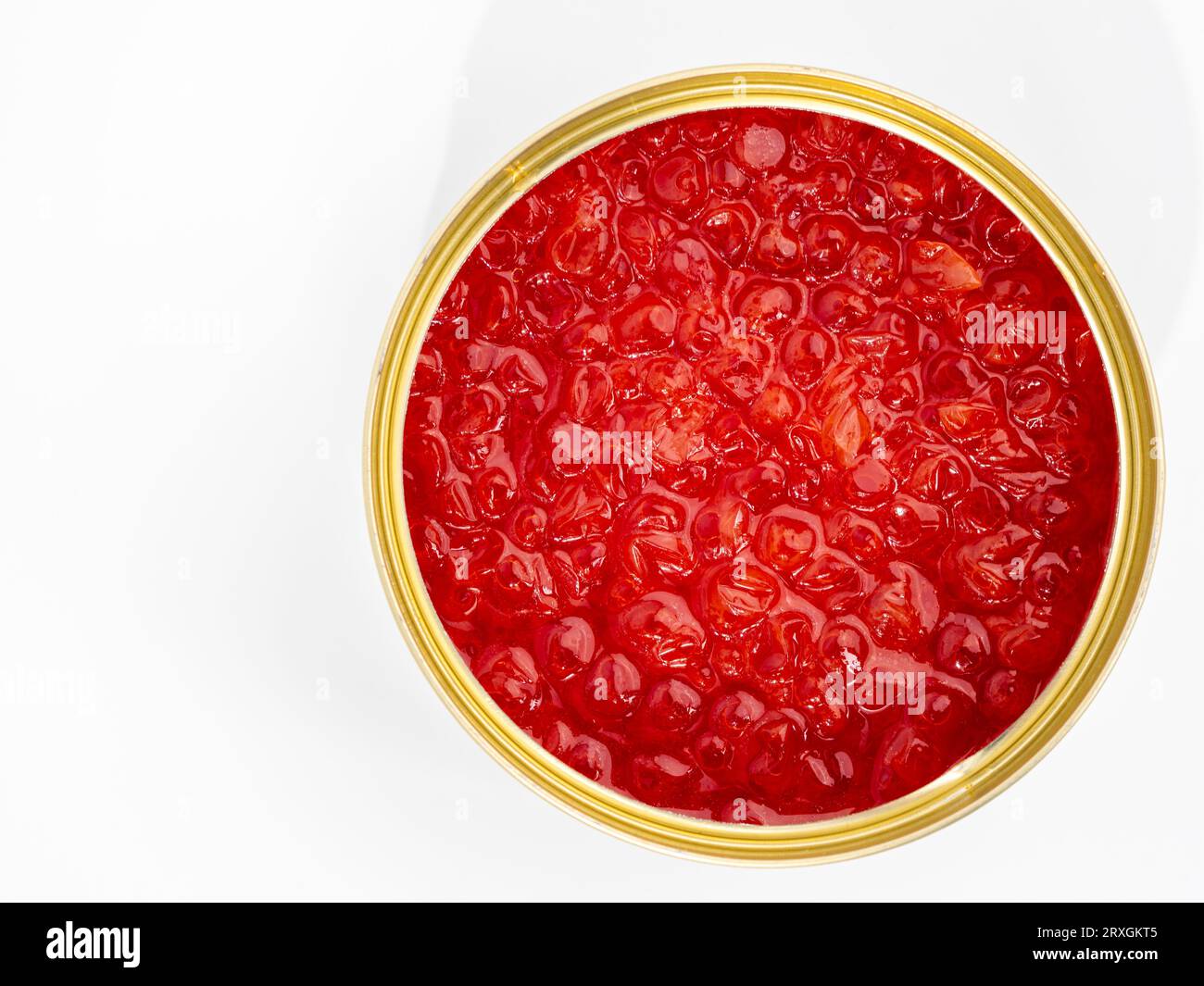 Open tin can with red caviar on a white background. Red caviar close-up ...