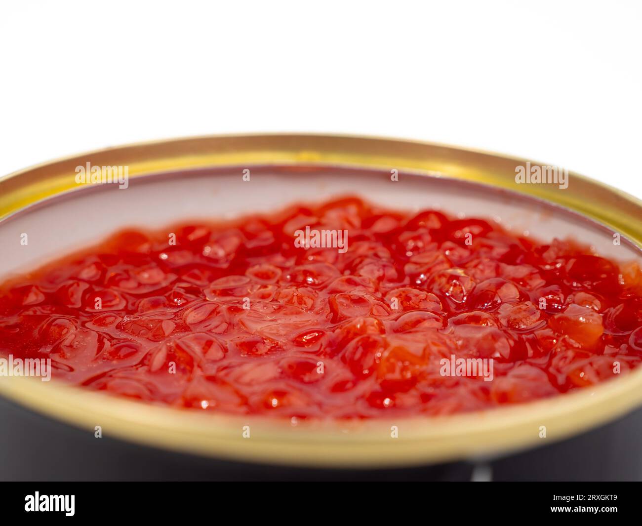 Open tin can with red caviar on a white background. Red caviar close-up ...