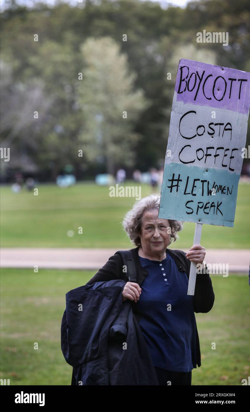 A woman holds a placard saying 'Boycott Costa Coffee' in Hyde Park ...