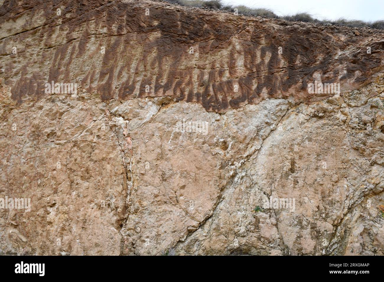 Slope with andesite rock (base) and pyroclastic on top. This photo was ...