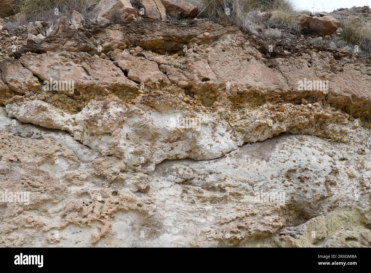 Slope with weathered andesite (base), volcanic breccia and pyroclastic ...