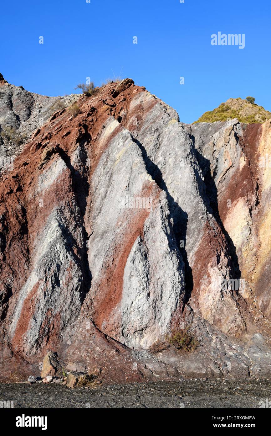 Colorful strata of alterated volcanic rocks. Sopalmo rambla, Cabo de ...