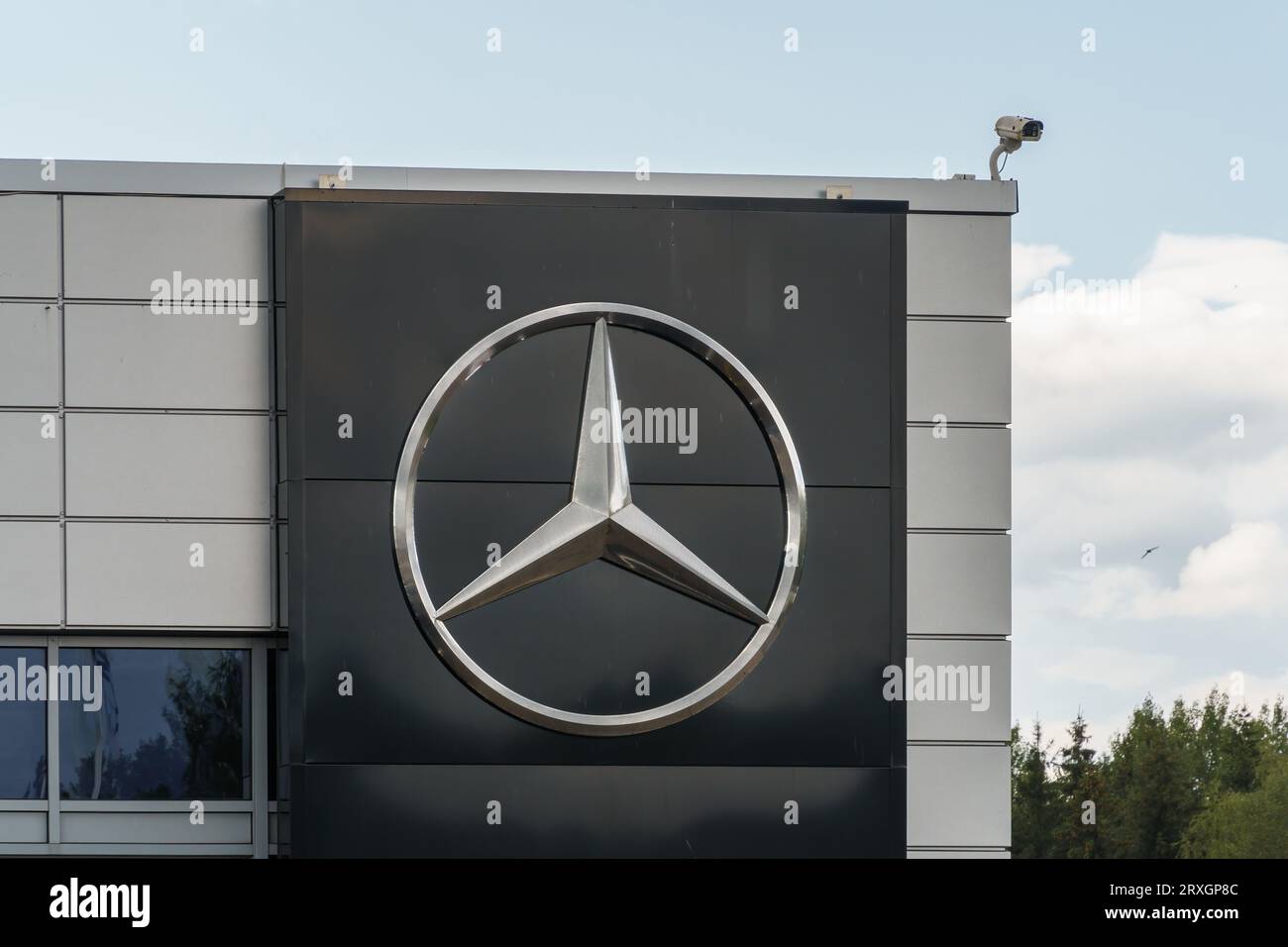 Mercedes Benz logo on the wall of a car dealer in Lahti, Finland. July ...