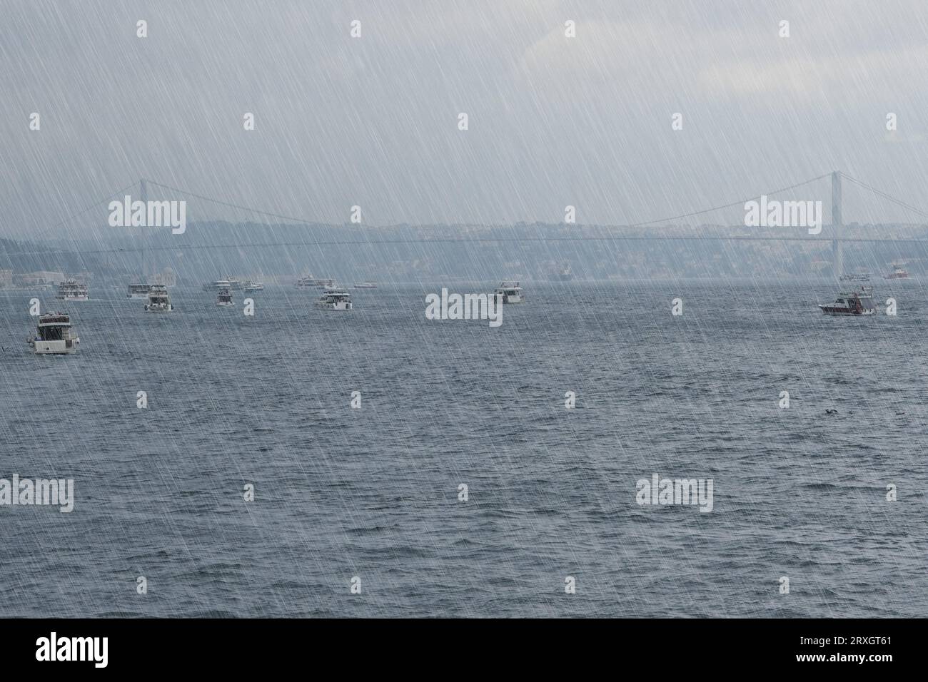 Rainy weather day in Bosphorus İstanbul with boats and Bosphorus Bridge ...