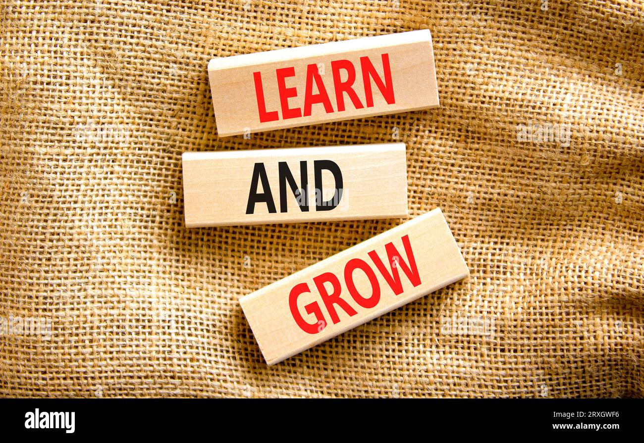 Learn and grow symbol. Concept word Learn And Grow on beautiful wooden ...