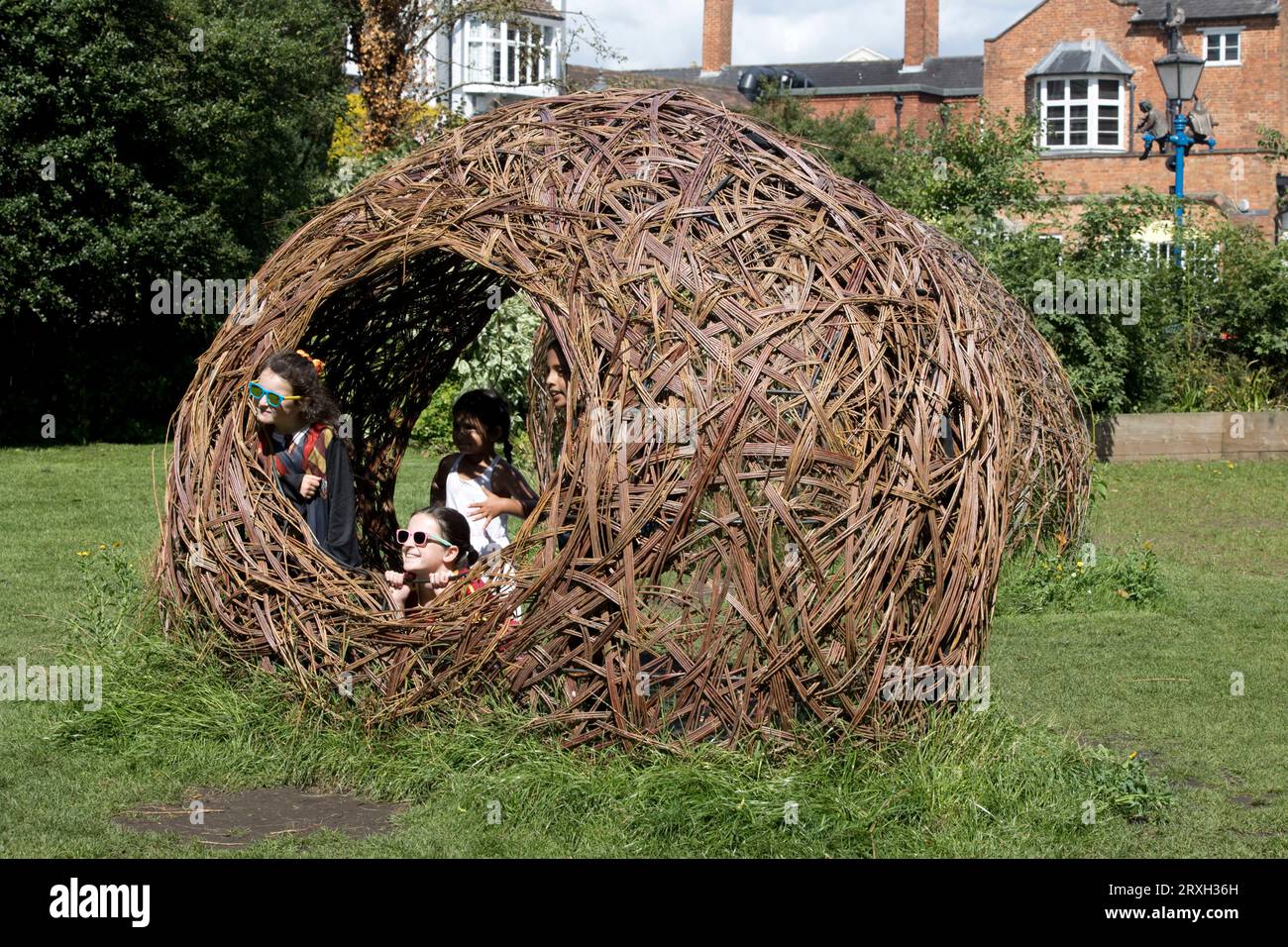 Children playing in Twin woven willow pods built by Forest Edge ...