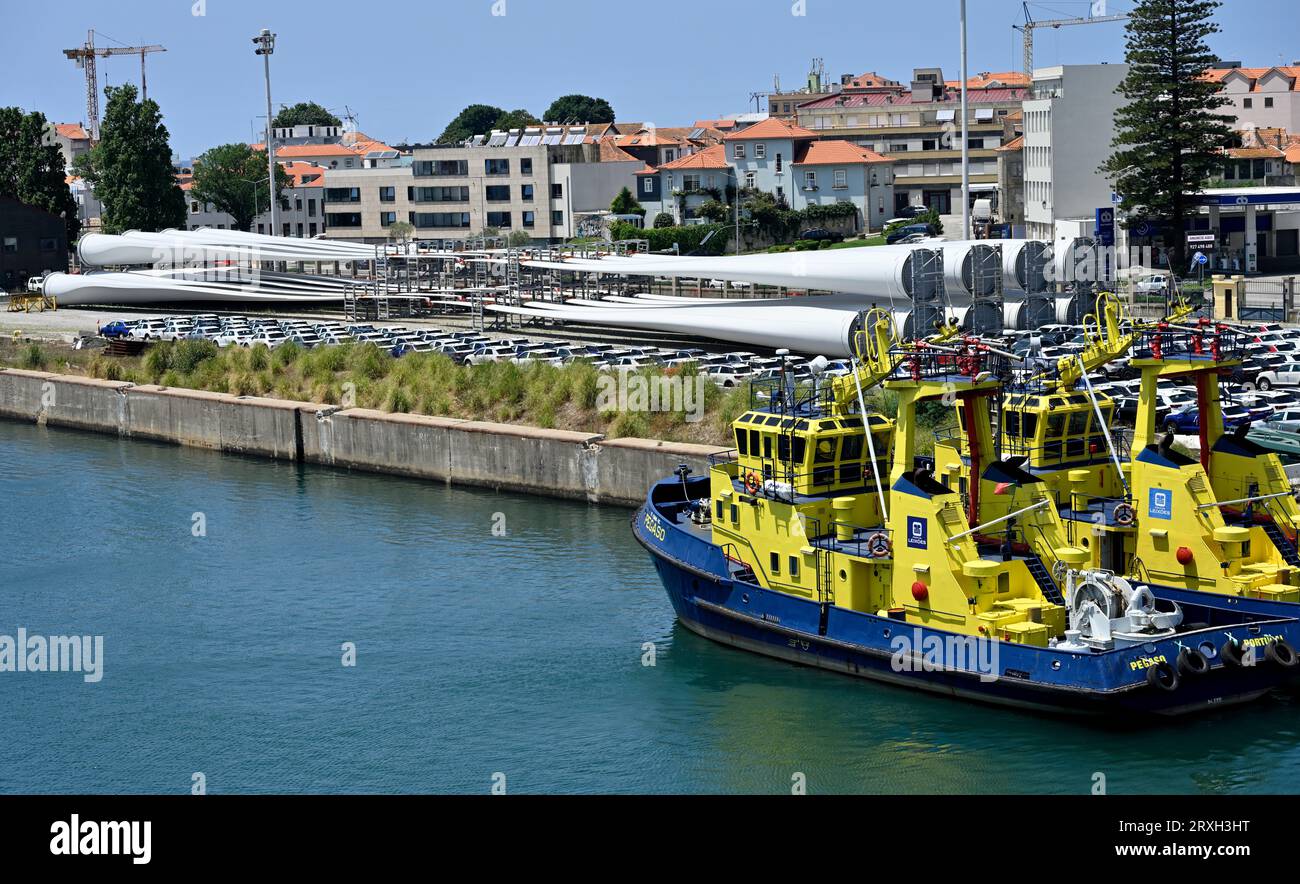 Commercial Port of Leixoes, Porto, with two tug boats and wind turbine ...
