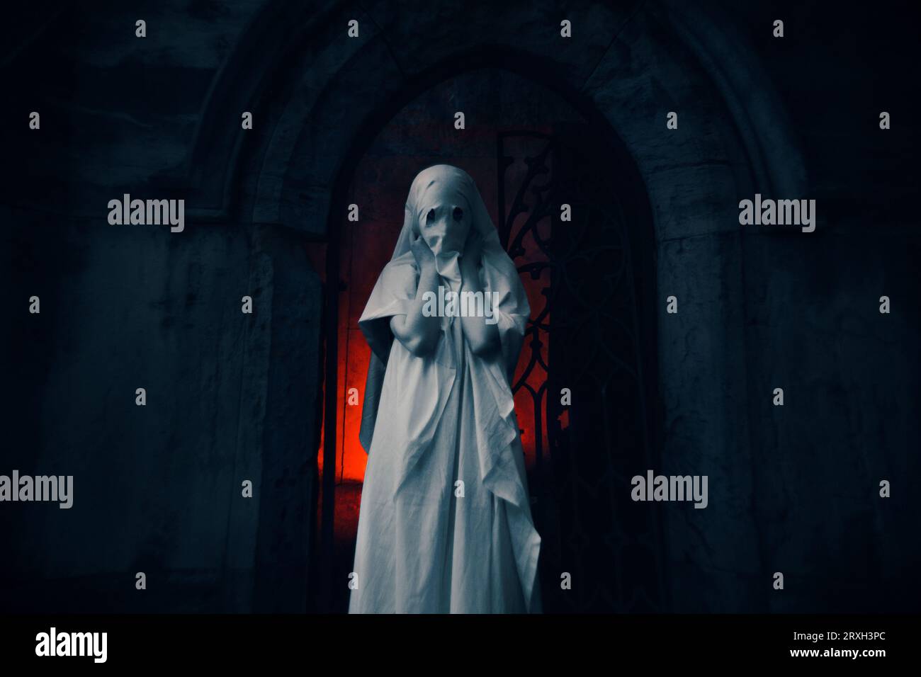 A mysterious figure standing at the entrance of an old medieval crypt ...