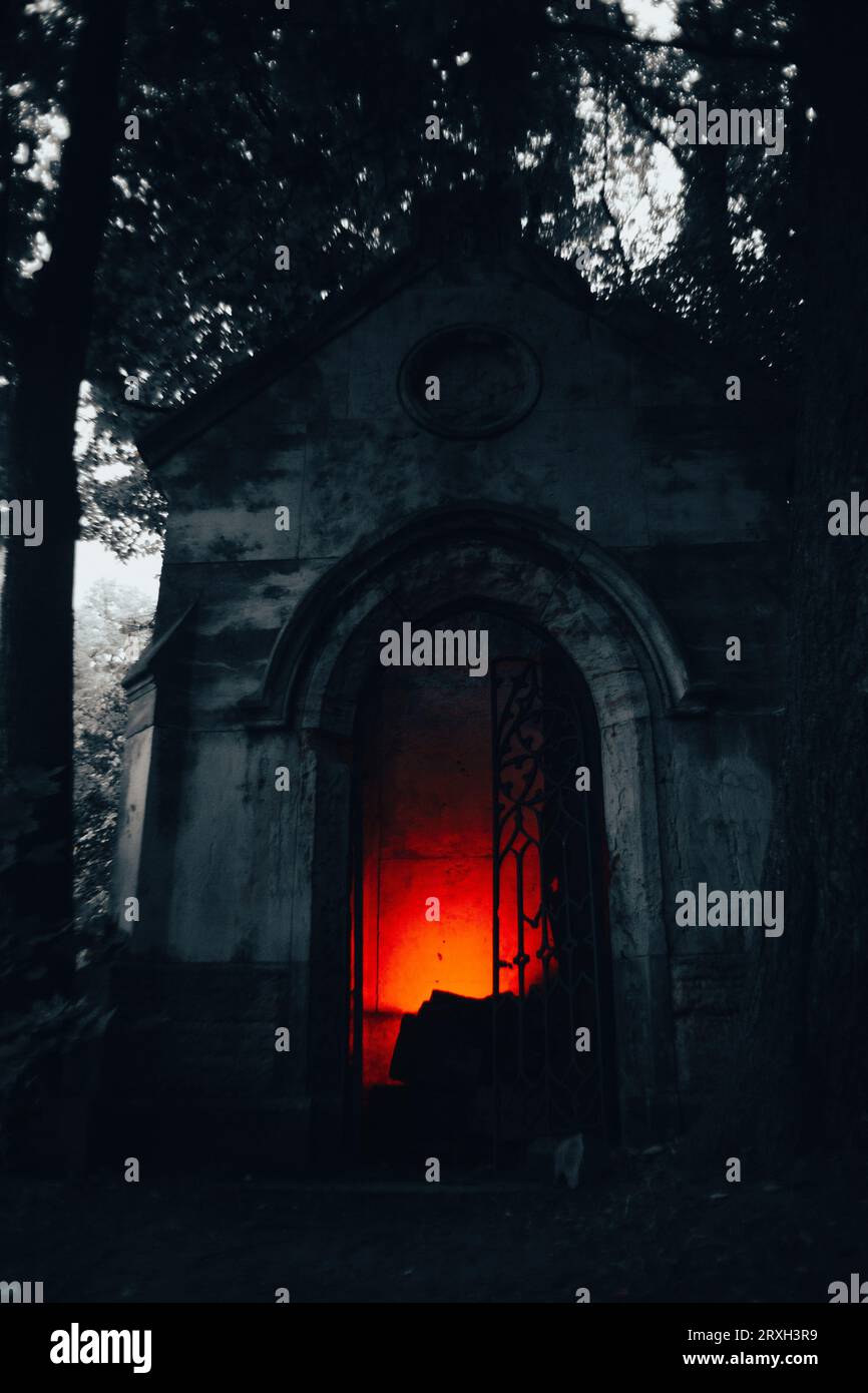A sinister stone mausoleum illuminated by an otherworldly red light ...
