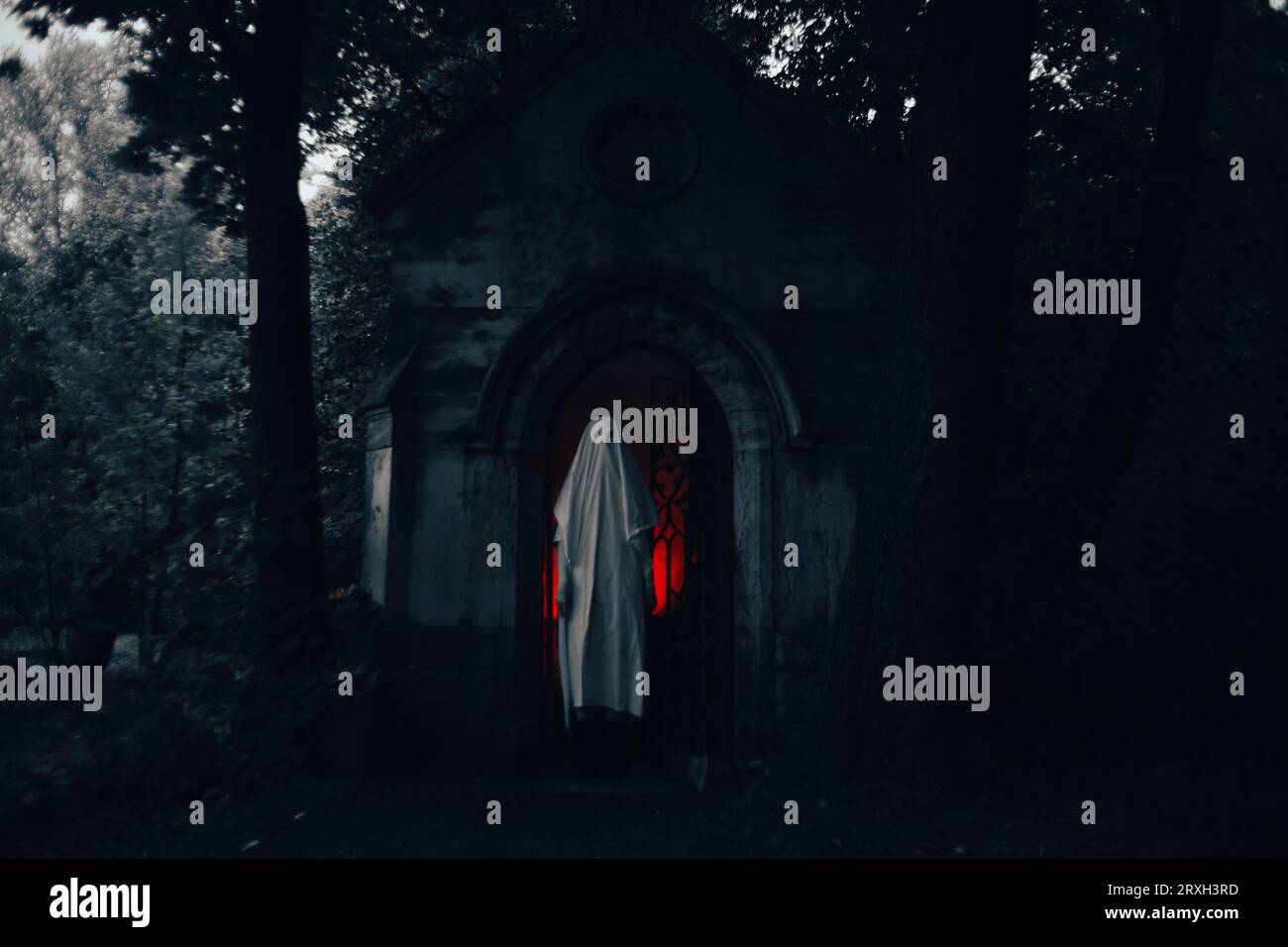 A horrifying ghost standing at the entrance of an old medieval crypt ...