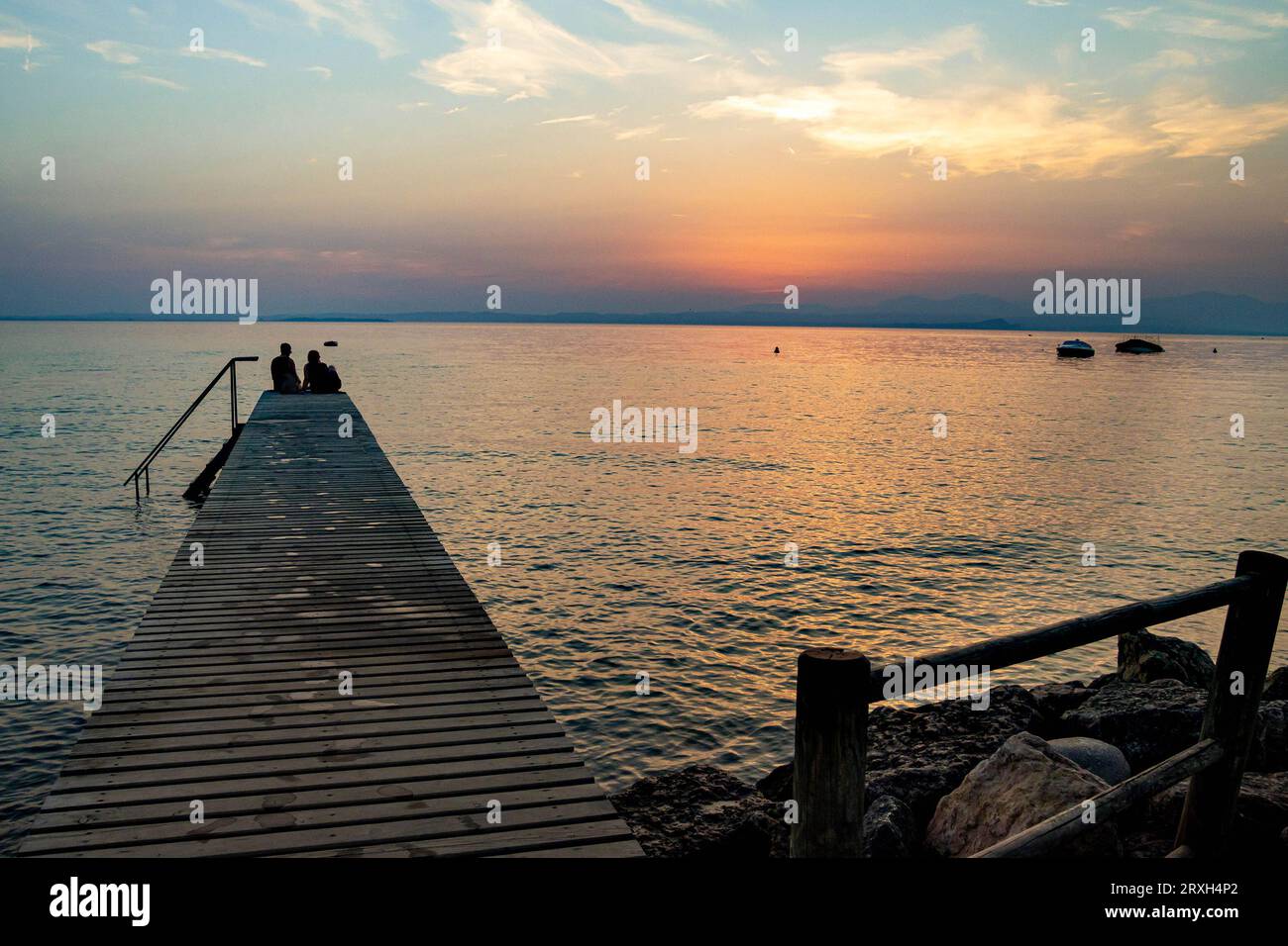 Lakeview at sunset from walkway at Cisano, Bardolino, Lake Garda, Italy ...