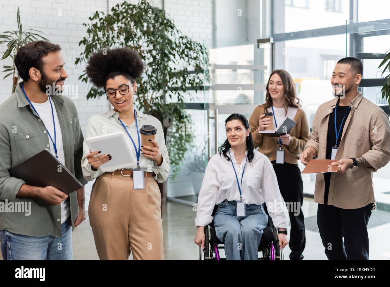 diversity and inclusion, disabled woman in wheelchair near interracial ...