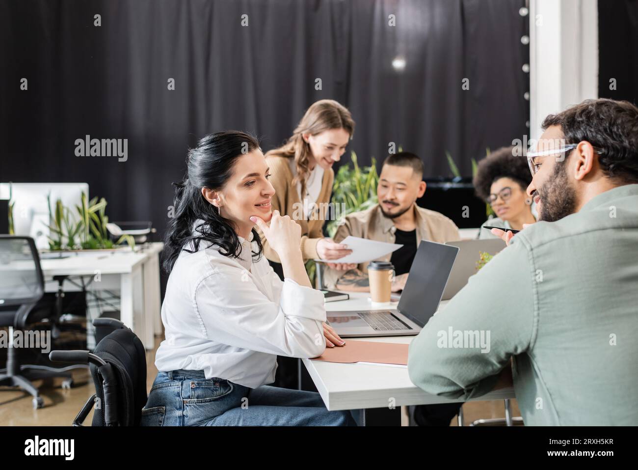 cheerful team lead listening ideas of indian coworker near ...