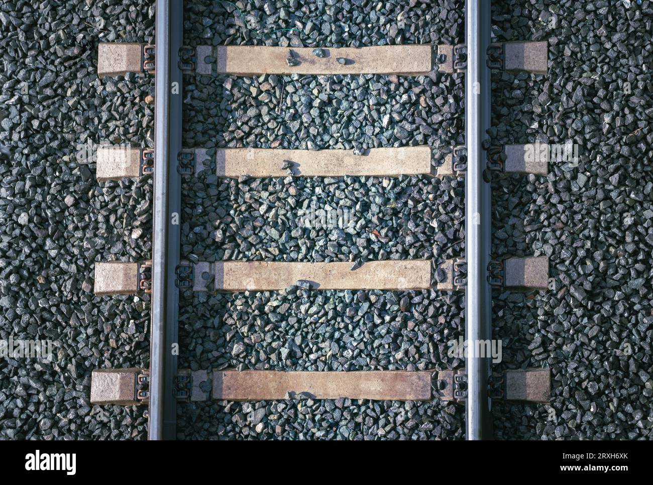 Close up of train tracks taken from above. This close-up aerial view meticulously showcases the ...
