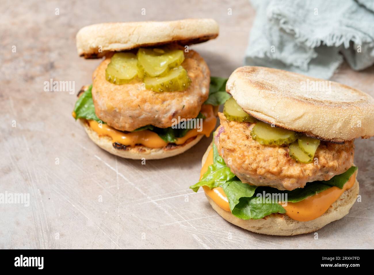 Salmon fishburger english muffin sandwich Stock Photo - Alamy