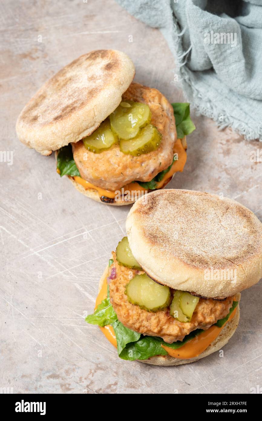 Salmon fishburger english muffin sandwich Stock Photo - Alamy