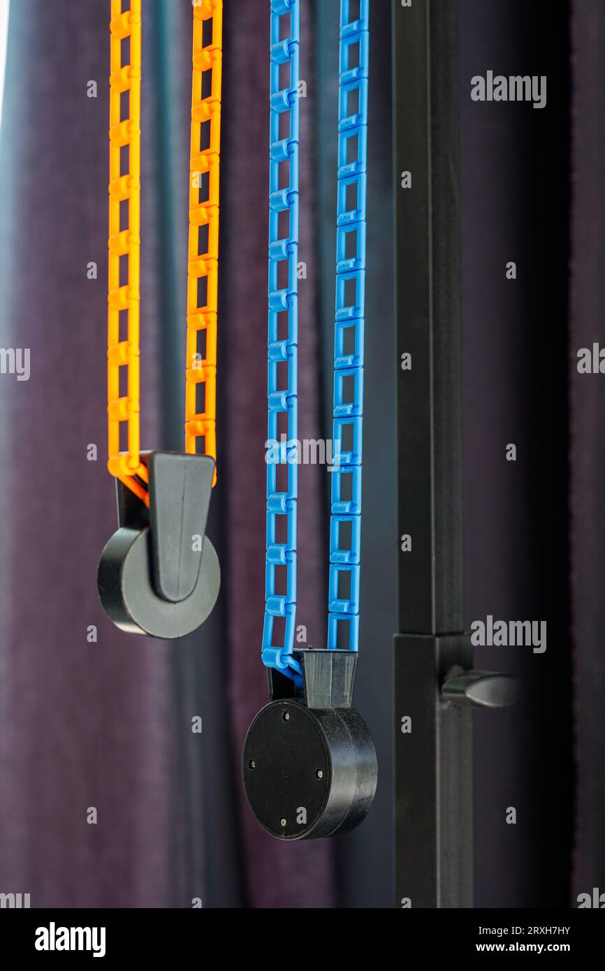 Manual mounting support system with two blue and yellow chains for ...