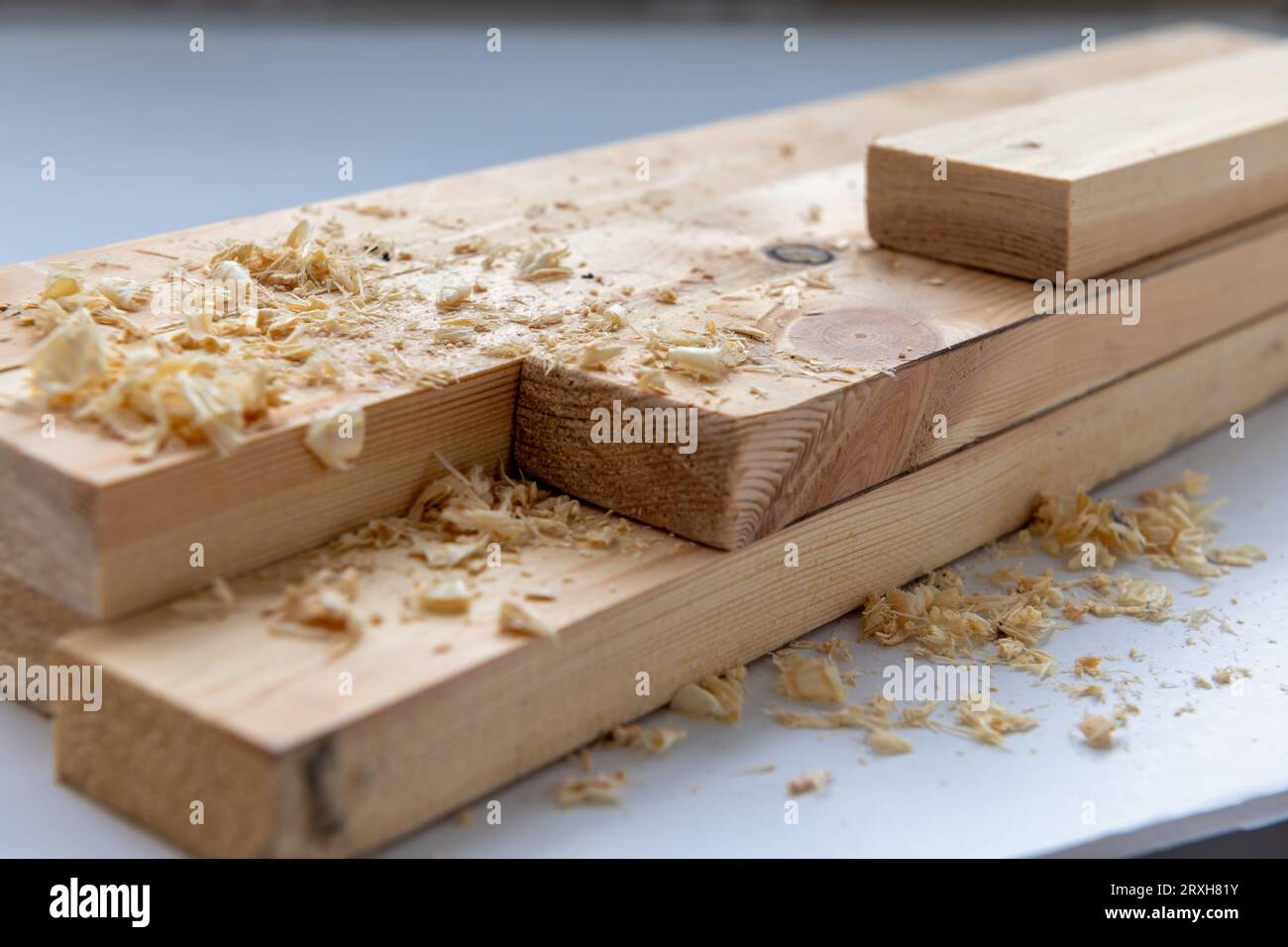 Close up of ready prepared pine wood timber with some wood shavings ...