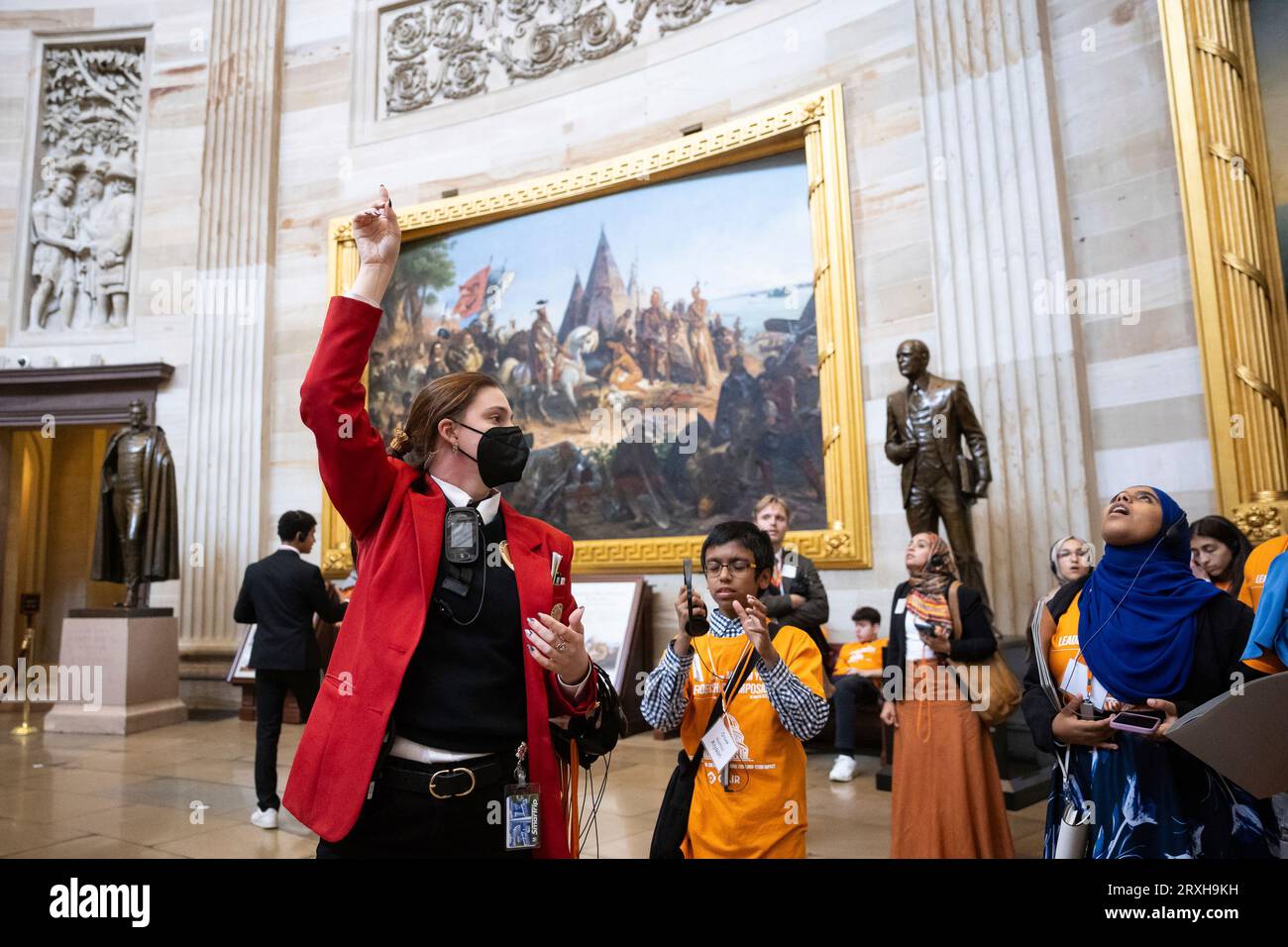A U.S. Capitol tour guide gives visitors a tour of the U.S. Capitol ...