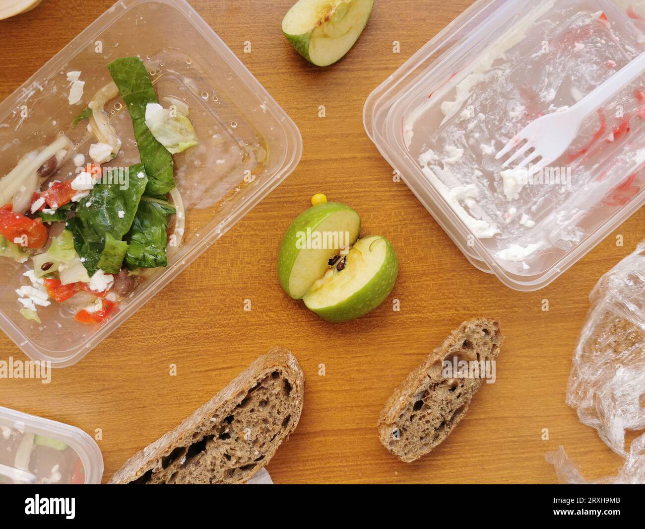 Leftover of food on table. Plastic boxes for recycling Stock Photo - Alamy