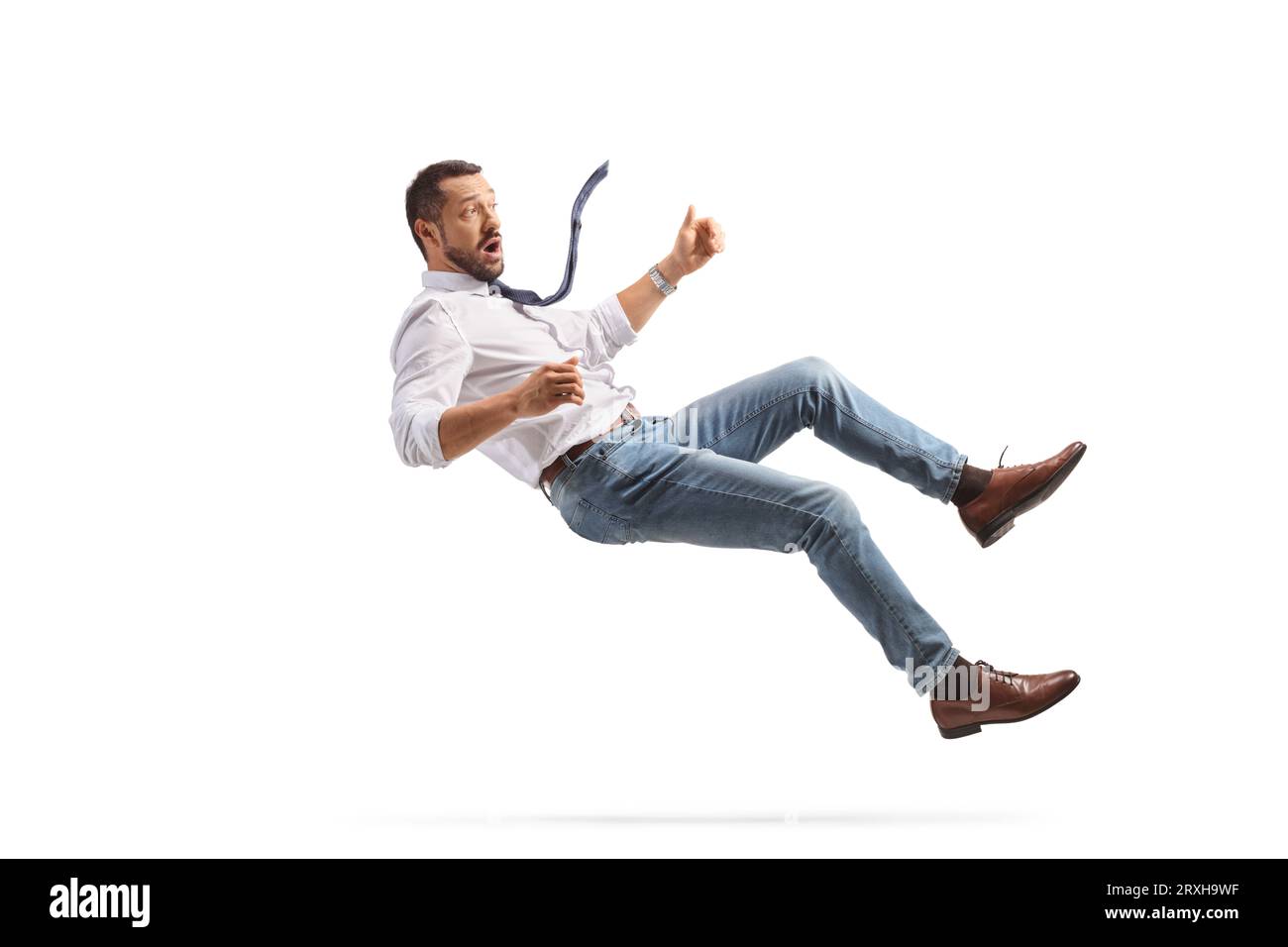 Scared young businessman falling isolated on white background Stock ...