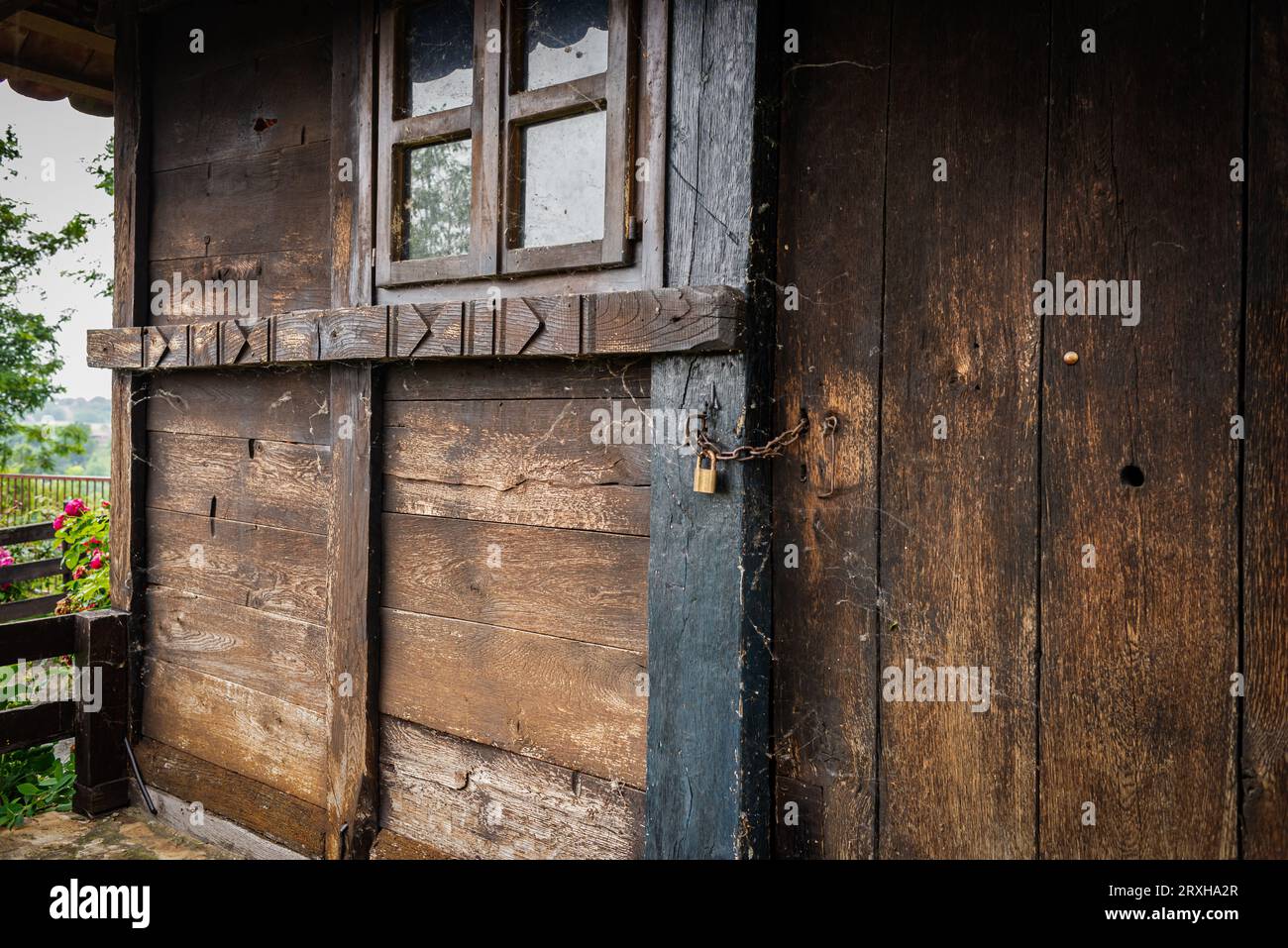 Wooden Front Door into rustic cabin with lock and padlock and chain ...