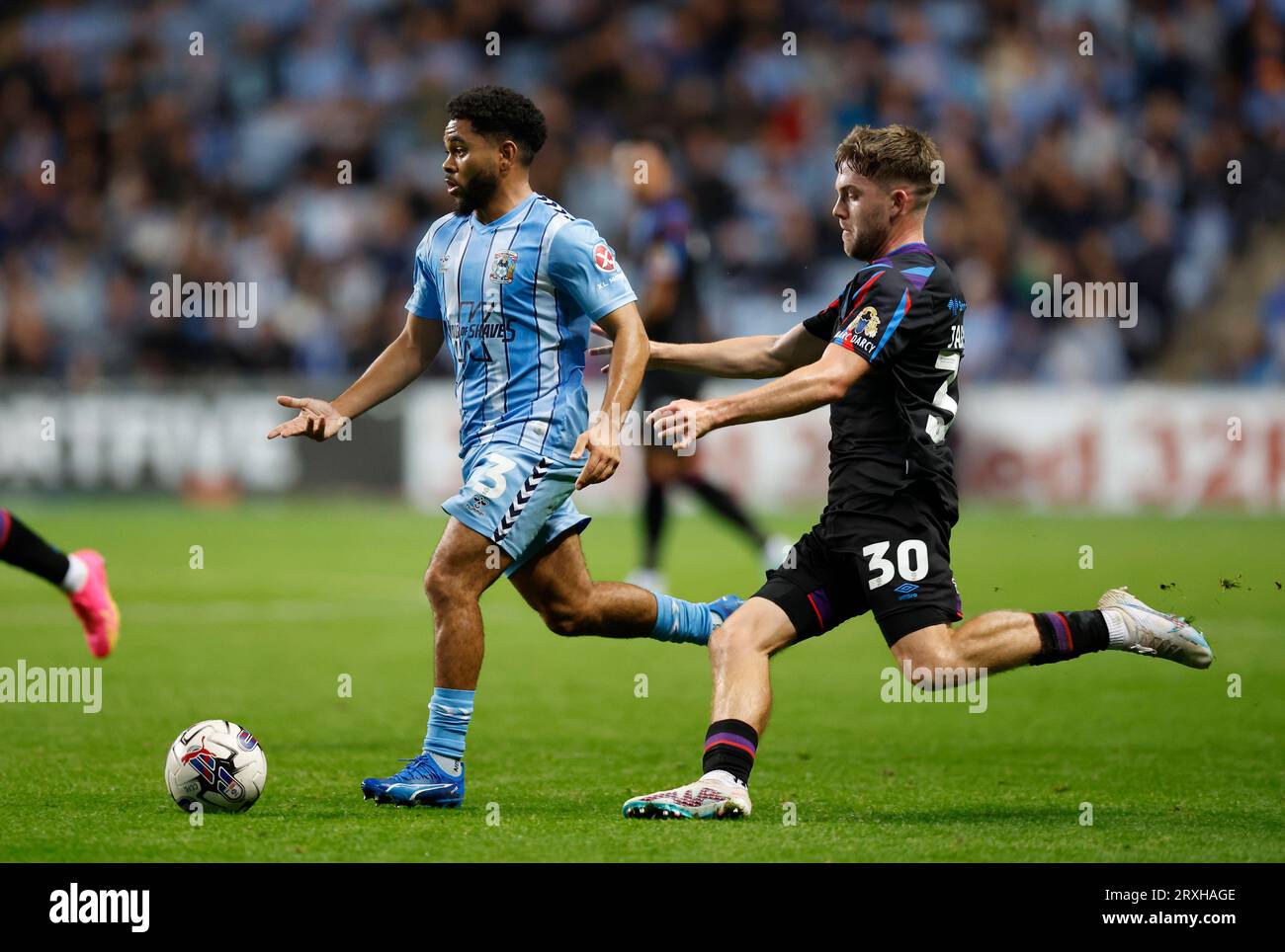 Coventry City's Jay Dasilva (left) and Huddersfield Town's Ben Jackson ...