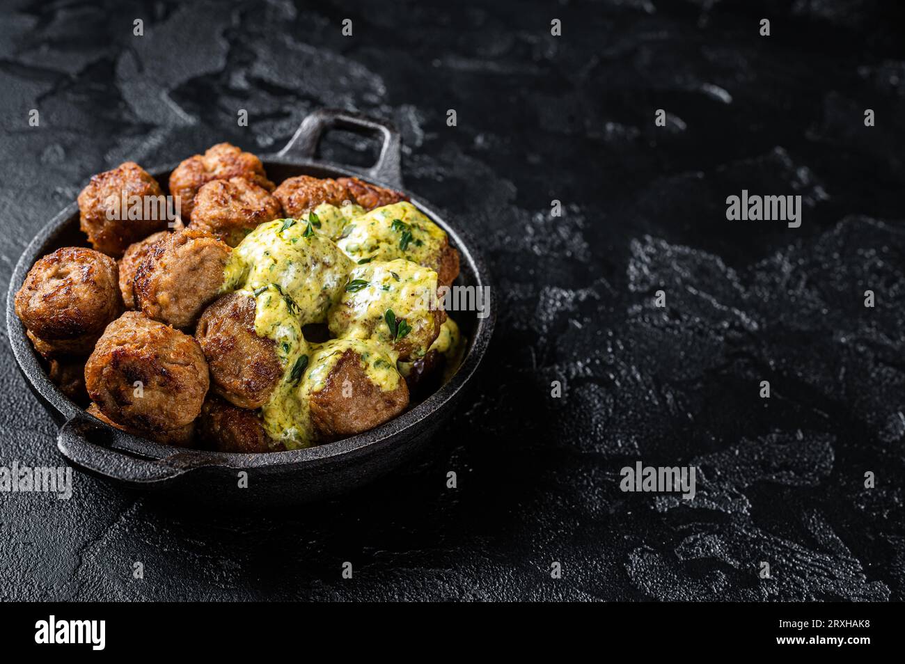 Skillet with Swedish beef Meatballs with Cream Sauce. Black background ...