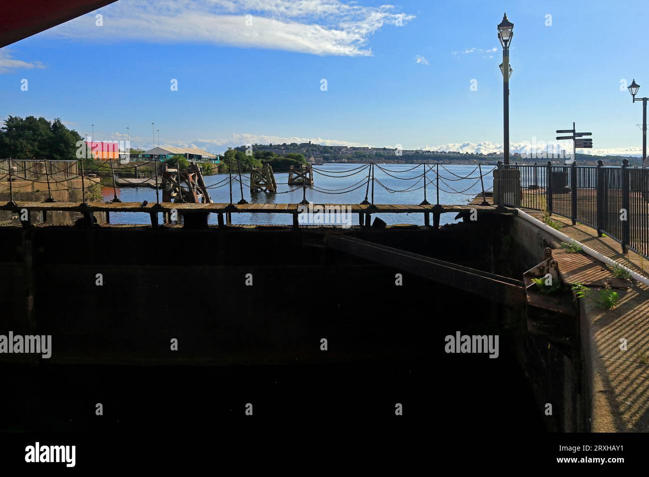 Disused wooden walkway with chain fencing on an old lock gate leading ...
