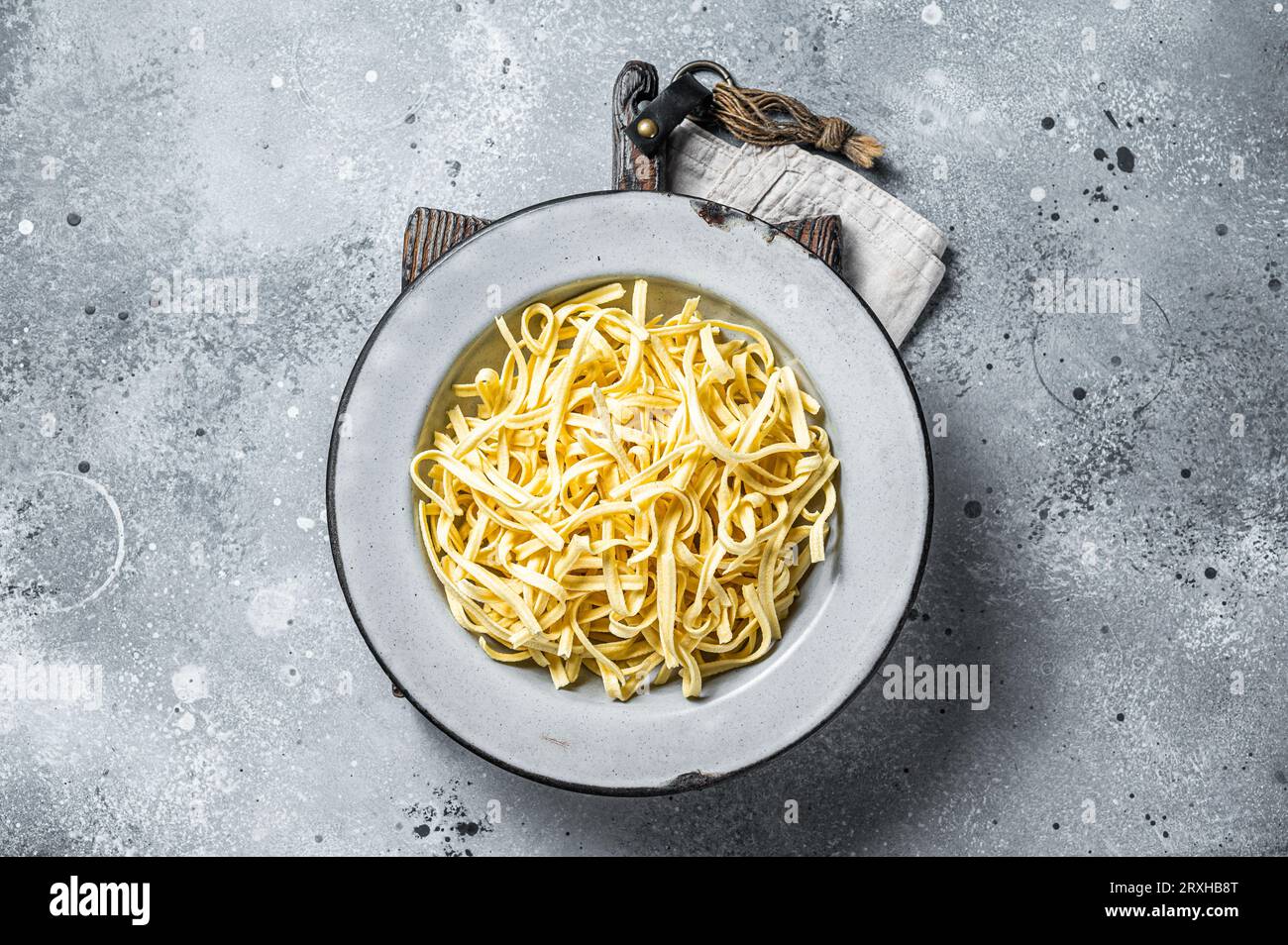 Raw dried spaetzle egg noodle. Gray background. Top view Stock Photo ...