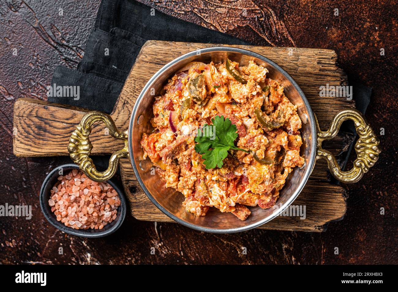 Turkish Menemen omelet with vegetabls and sucuk in askillet. Dark ...