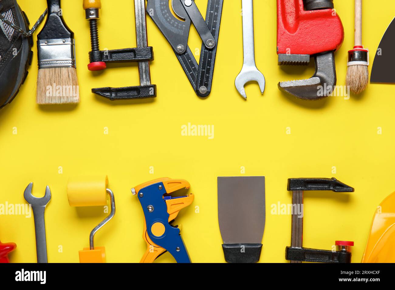 Frame made of different construction tools on yellow background Stock ...