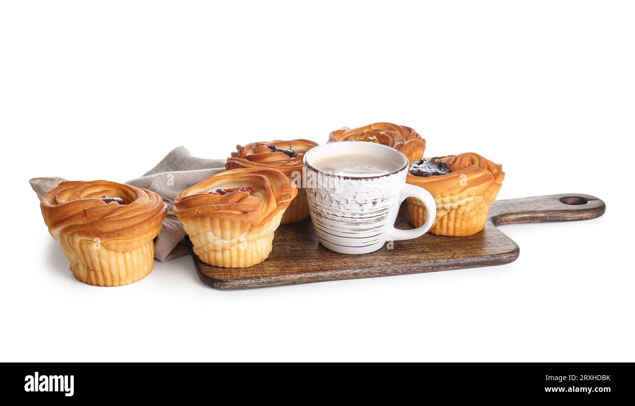 Tasty cruffins and cup of coffee on white background Stock Photo - Alamy