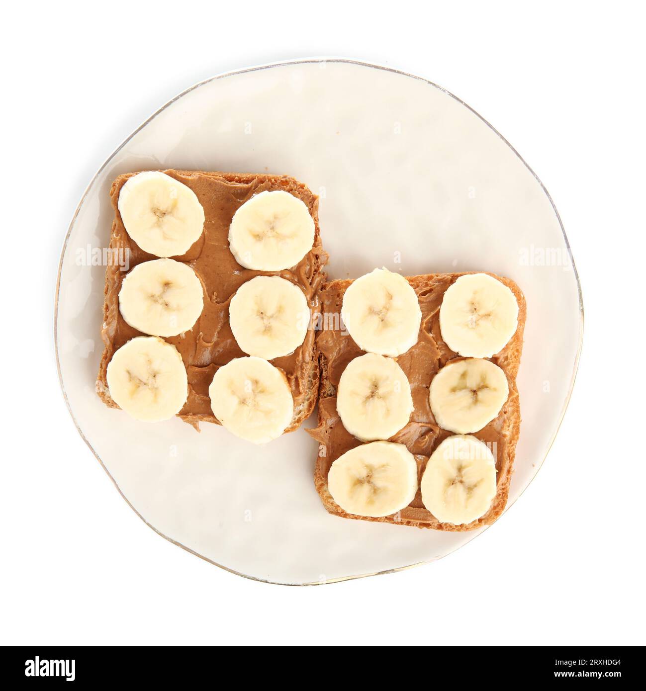 Plate of toasts with peanut butter and banana on white background Stock ...