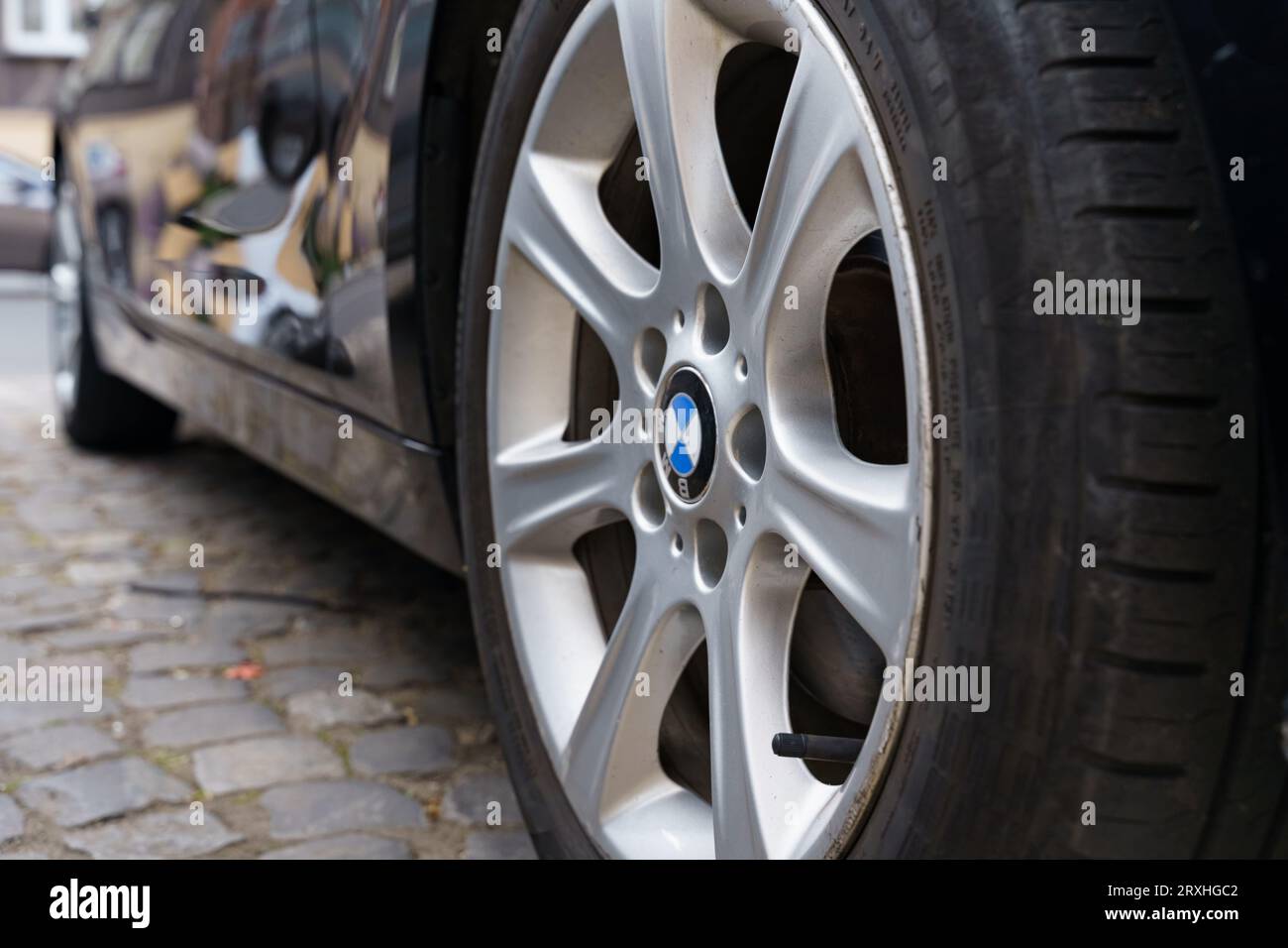 Poznan, Poland - June 18, 2023: The BMW company logo is on the rim of a ... Poznan, Poland - June 18, 2023: The BMW company logo is on the rim of a ...