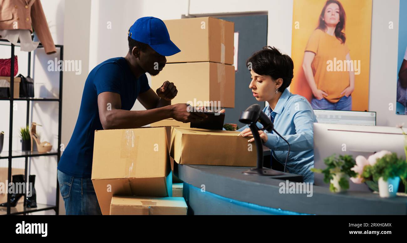 Delivery man putting carton boxes hi-res stock photography and images ...