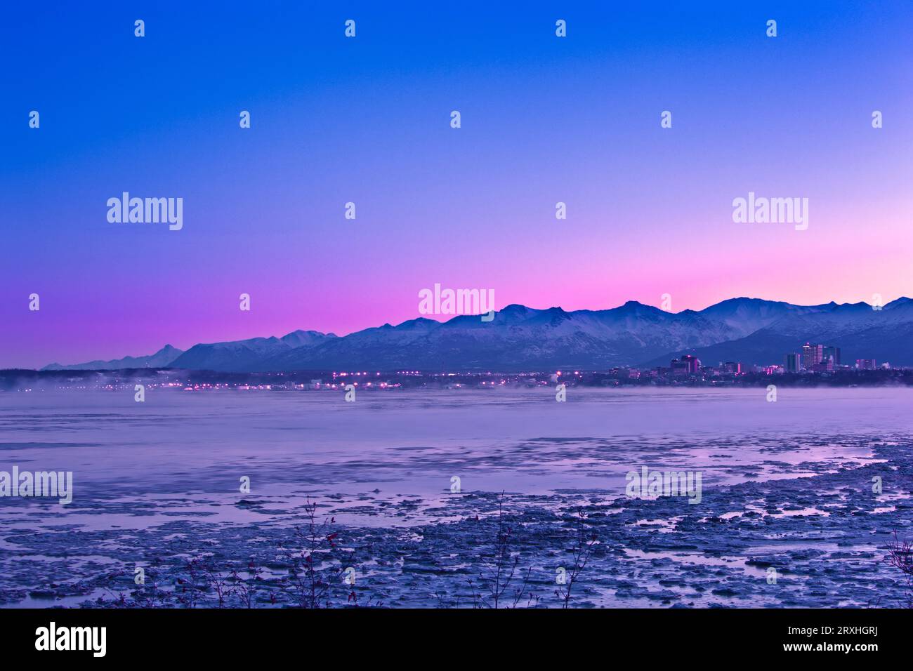 The Anchorage Skyline Before Dawn With Fog Rising From The Waters Of ...