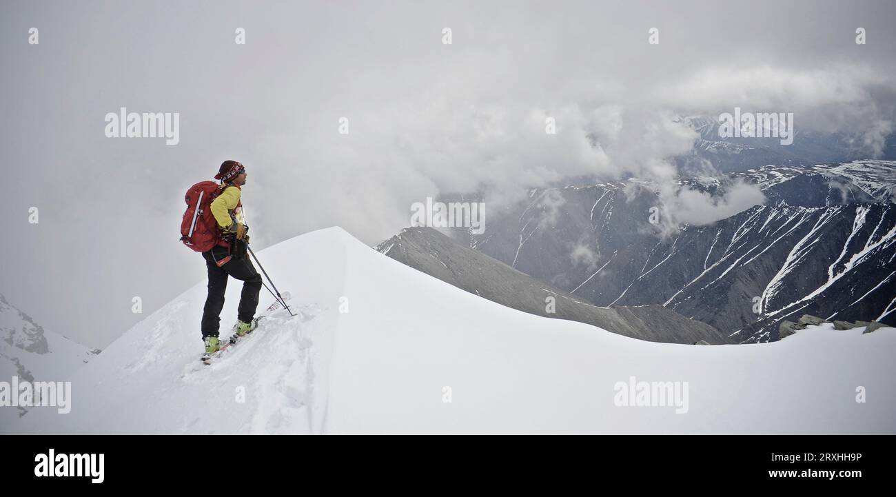 Man Skiing The North Ridge From The Summit Of Mt. Chamberlin In The ...