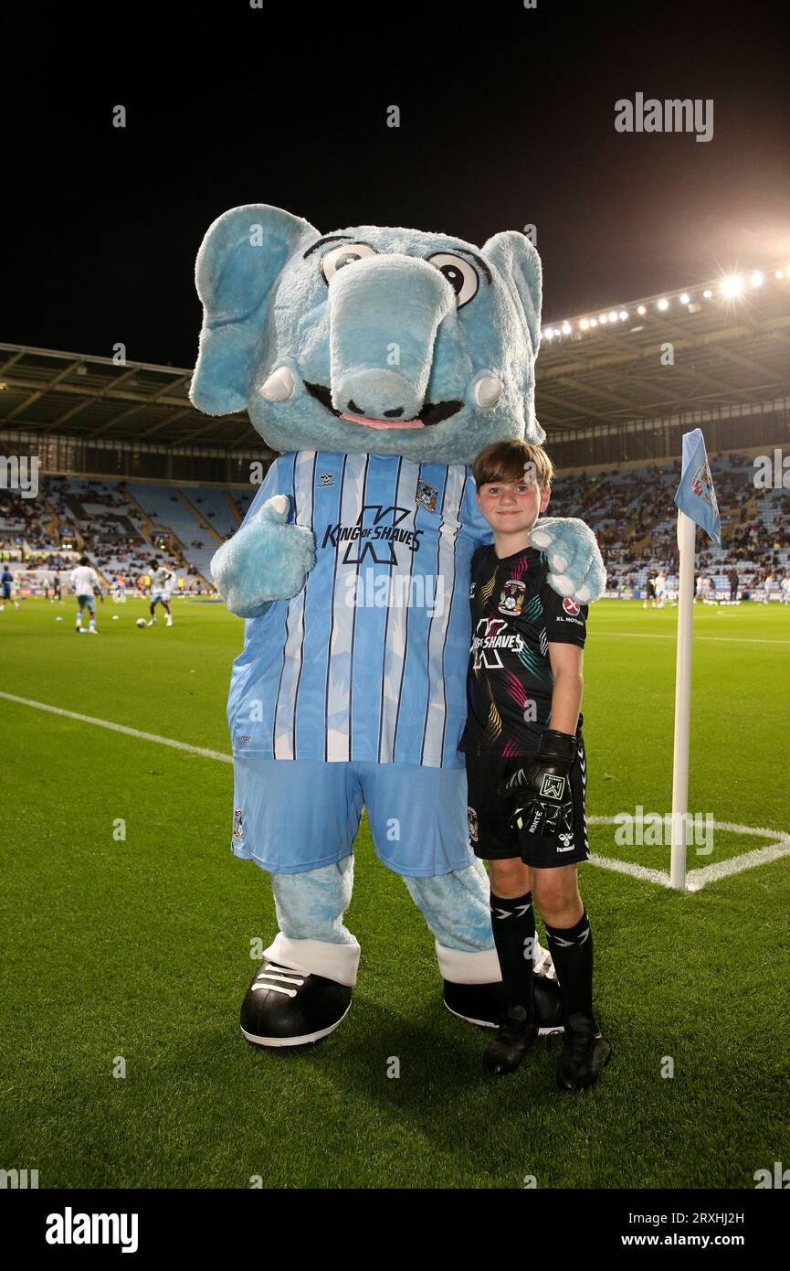 Coventry City mascot Sky Blue Sam poses for a photo with a matchday ...