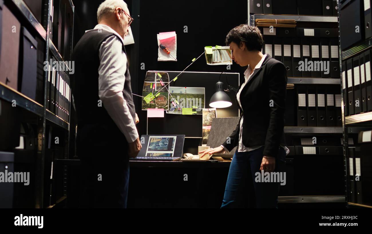 Law agents review police archive records in incident room, gathering ...