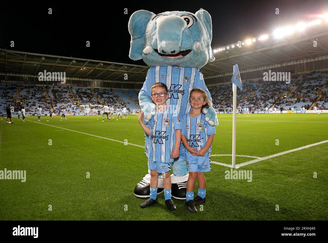 Coventry City mascot Sky Blue Sam poses for a photo with a matchday ...
