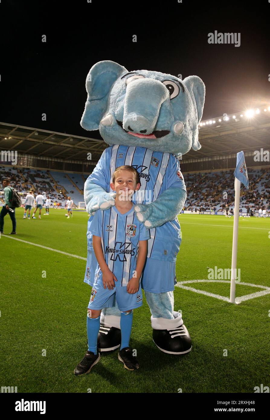 Coventry City mascot Sky Blue Sam poses for a photo with a matchday ...