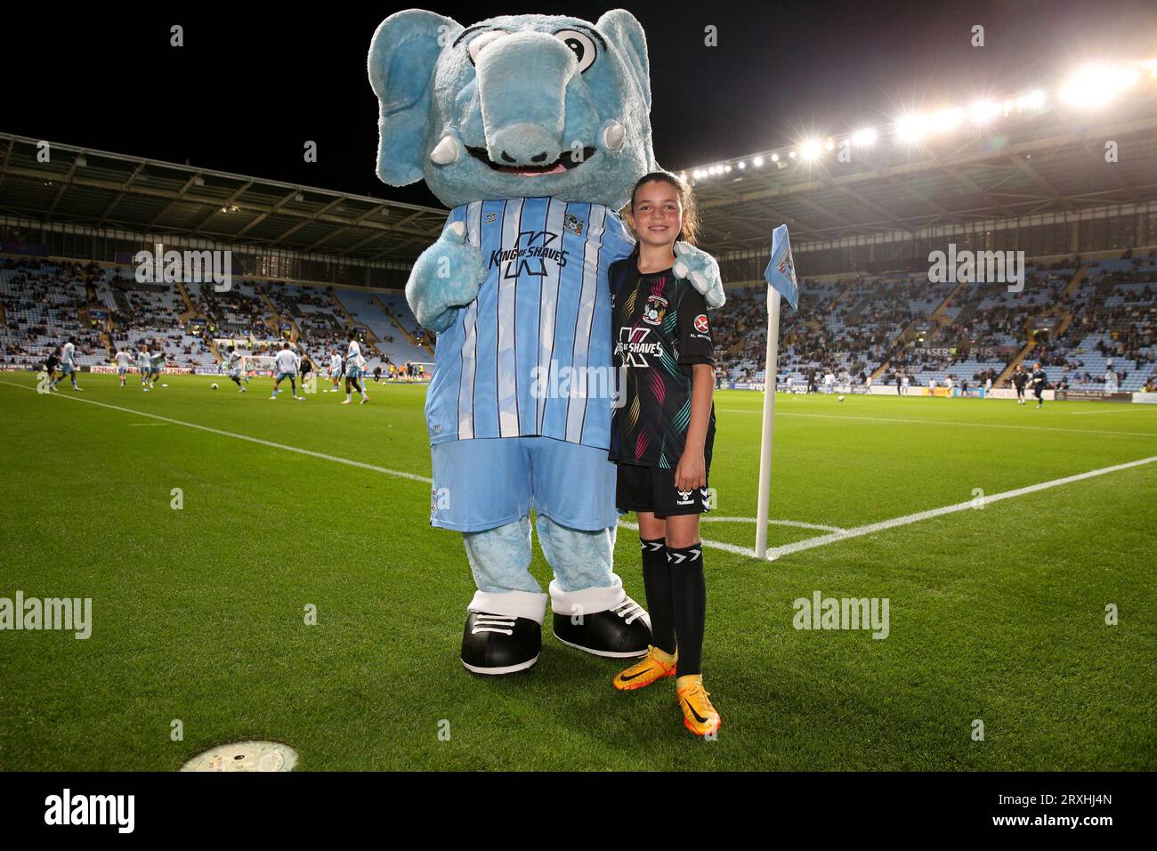 Coventry City mascot Sky Blue Sam poses for a photo with a matchday ...