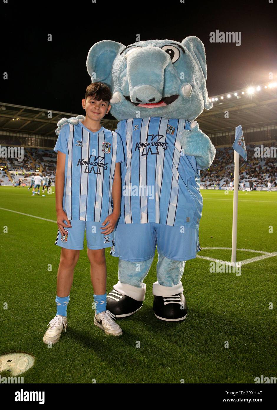 Coventry City mascot Sky Blue Sam poses for a photo with a matchday ...