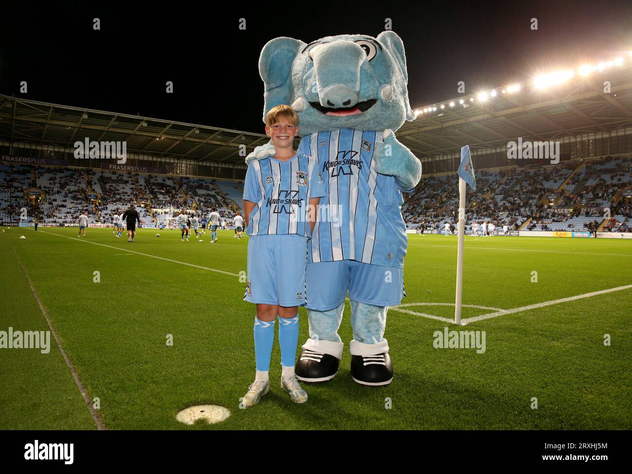 Coventry City mascot Sky Blue Sam poses for a photo with a matchday ...